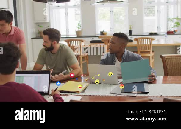 Standing man leaning on table addressing team creating floating ...