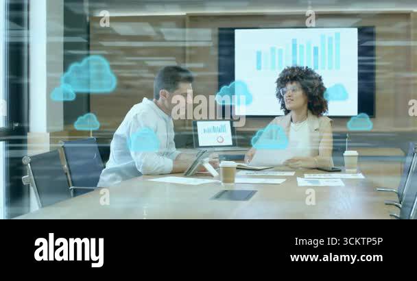 Colleagues tapping tablet and discussing tech data causing cloud icons floating and charts ...