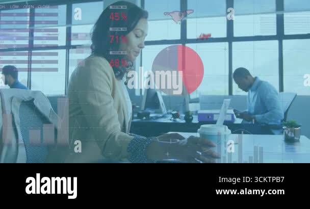 Woman hovering finger over laptop initiating animated business data charts for live analysis ...