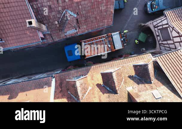 Aerial view of a Garbage refuse recycling truck in Residential area ...