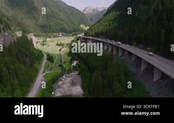 Aerial view of a highway Overpass Viaduct Bridge in Alps Mountains ...