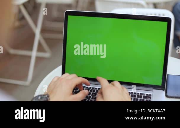 hand man use laptop computer with green screen chroma key display ...