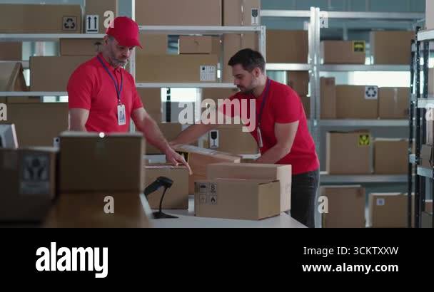 Caucasian bearded couple of manager and postal deliveryman wearing red ...