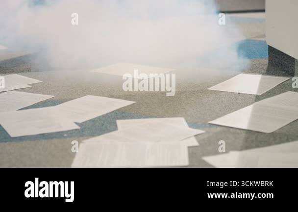 Something smoking in modern office. Documents throwing on floor ...