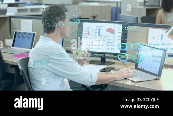 Office worker eating salad and viewing finance charts with holograms while coworker offering ...