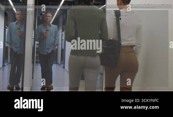 White man holding cup approaching mirror initiating network scan ...