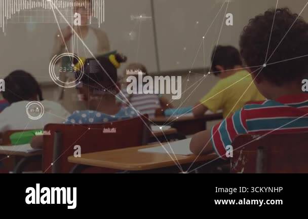 Teacher flipping page and pointing at students writing with education ...