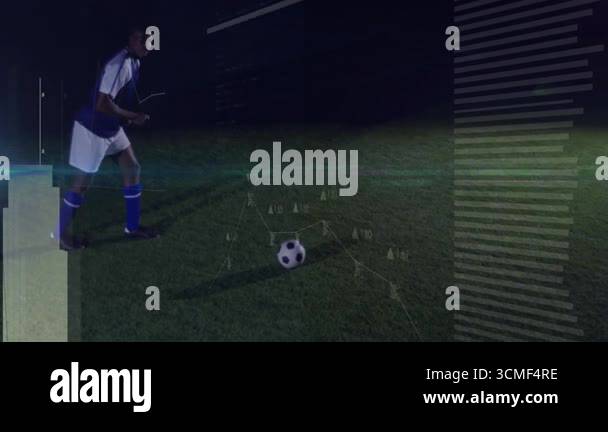 Male soccer player shifting weight and kicking ball while digital HUD ...