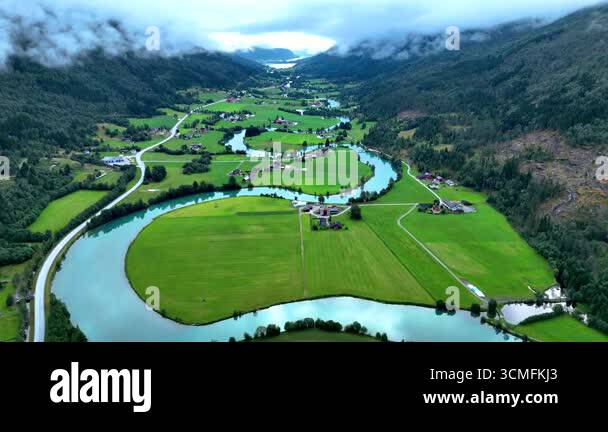 Breathtaking vista of Stryn, Norway showcasing vibrant green fields and ...