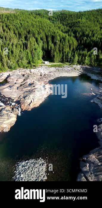 Nestled in Norways stunning countryside, a tranquil body of water ...