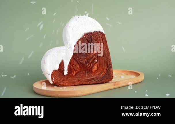 Shredded sweet coconut flakes fall into Heart shaped coconut flavor ...
