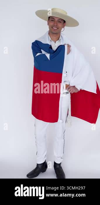 Man wearing white clothes holding large chilean flag Stock Video ...