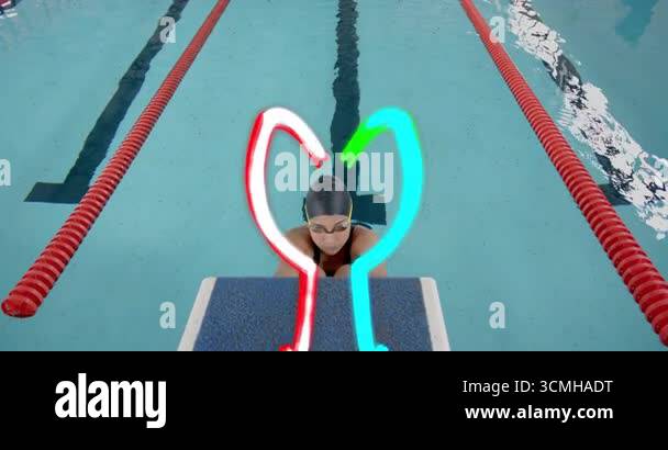 Female swimmer pushing off wall for backstroke in pool with neon trails ...