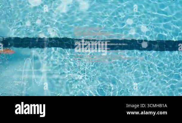 Swimmer stroking under overhead camera with lane marker and tech ...