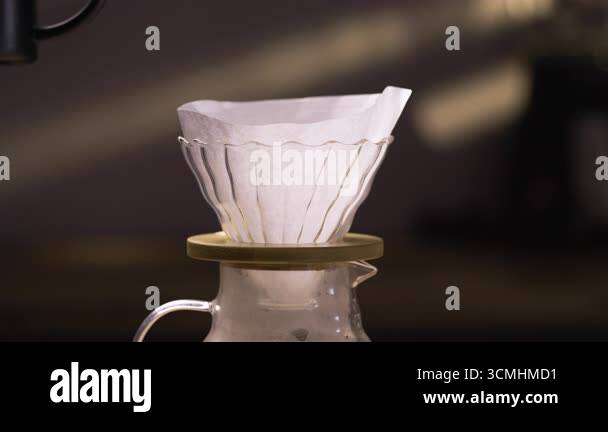 alternative brewing process making drip filter coffee, pouring hot ...