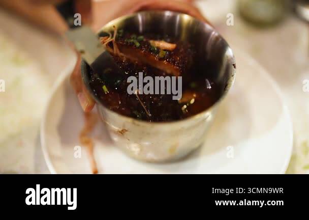 Chef prepares traditional Dong Po pork dish Stock Video Footage - Alamy