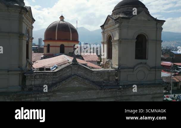 Drone video of a colonial church front and twin bell towers while a ...