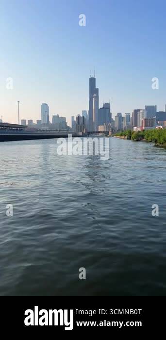 Scenic vertical view of Chicago skyscrapers with river and waterfront ...