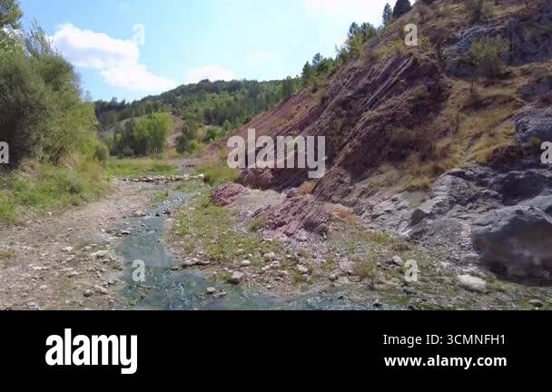 Canyon Creek with Shallow Water and Rocky Walls.A tranquil scene of a ...