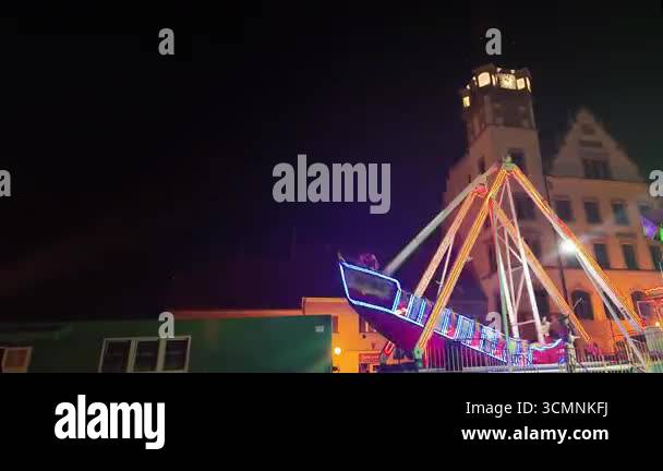 A popular attraction known as a pirate ship and a fairground merry go ...