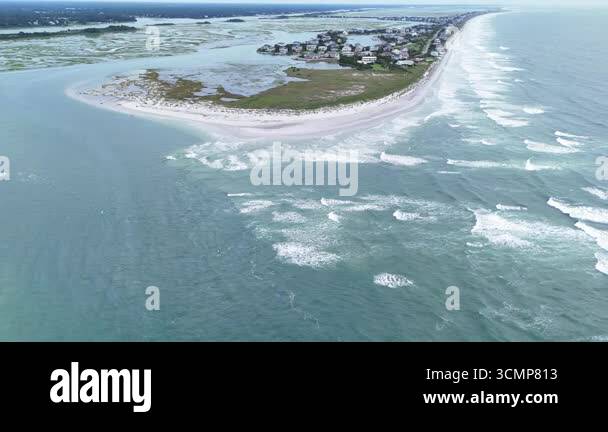 Scenic drone footage of a barrier island coastline surrounded by ...