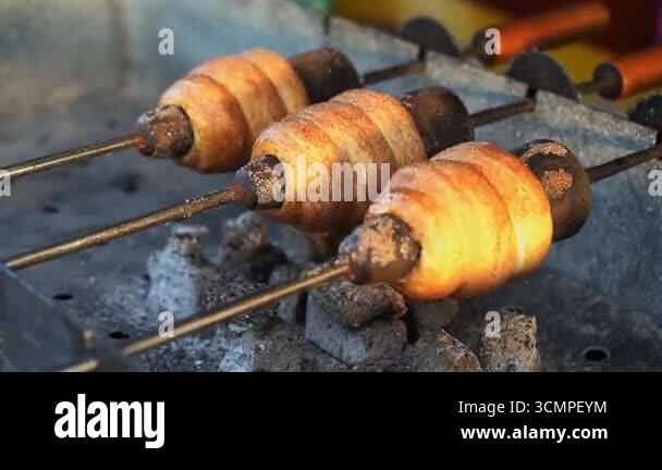 Street Food Trdelnik Baking on Charcoal. Traditional Pastry Experience ...