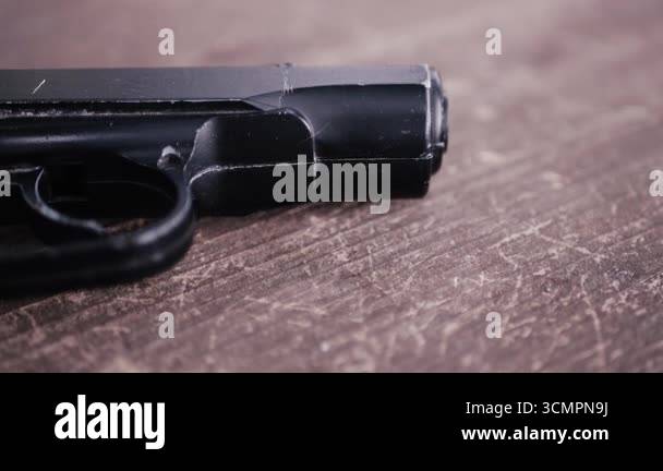 The soldier takes the loaded pistol from the table. A loaded pistol ...