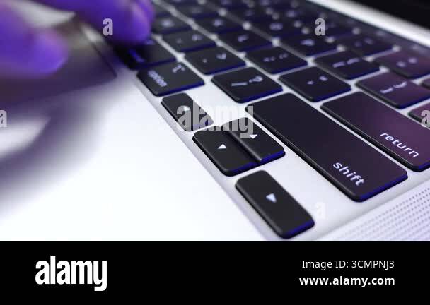 Close-up of a finger pressing keyboard keys during computer work ...