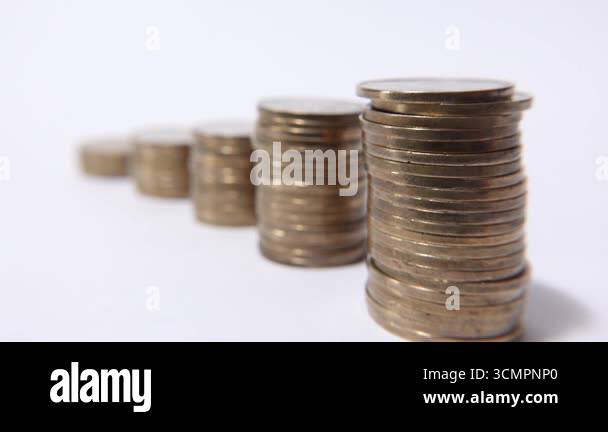 Close-up of a hands stacking growing piles of gold coins Money. Hand ...