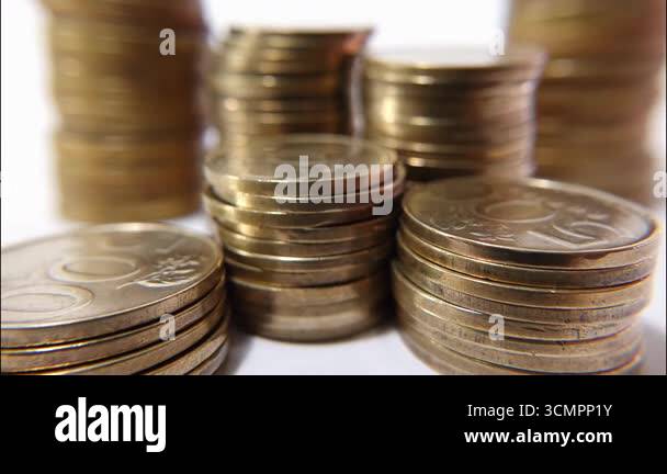 Time lapse of gold coins fading into white background, visual metaphor ...