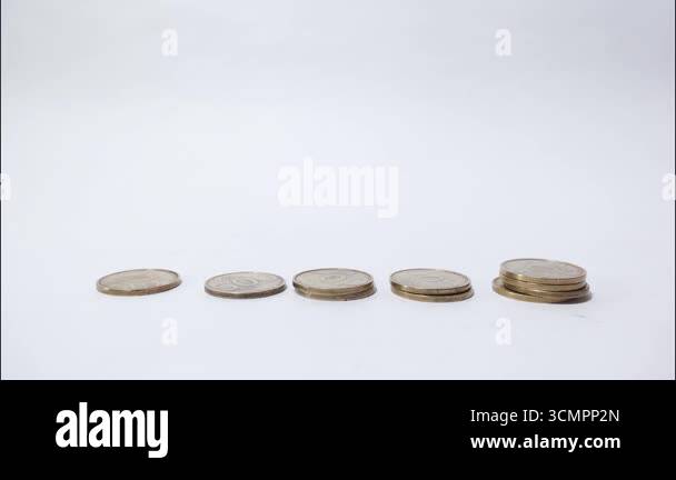 Golden coins growing and multiplying on a clean white background ...