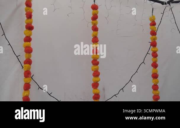 hanging strands of colorful pom-poms and flowers for celebrations and ...