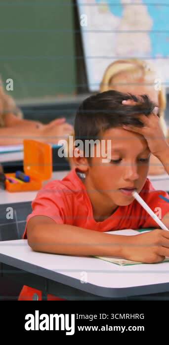 Children studying in classroom with sports icons animation over them ...