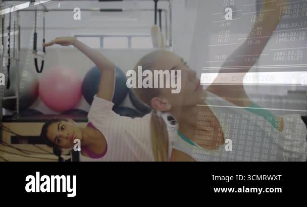 Camera panning revealing women doing Pilates side stretch in sync for ...