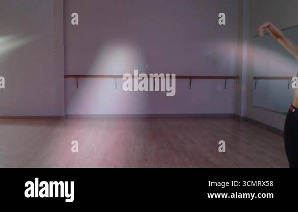 Female dancer entering dance studio after pause and executing fluid ...