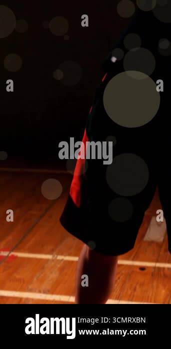 Animation of caucasian basketball player stretching and spots of light ...