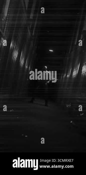 Animation of black and white scratched film of scary figure in dark ...