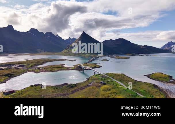 Drone shot of dramatic coastal landscape with pyramid-shaped mountain ...
