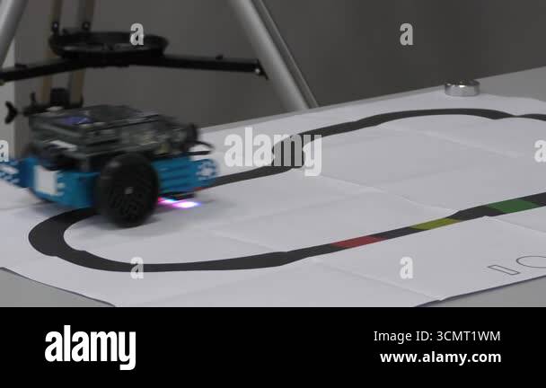 Small wheeled robot following a black line on the floor during a ...