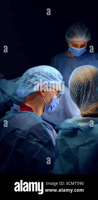 Surgeons operating in sterile area. Medical professionals are engaged ...