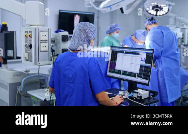 Surgery team in an OR. Surgeons and medical staff collaborate in an ...