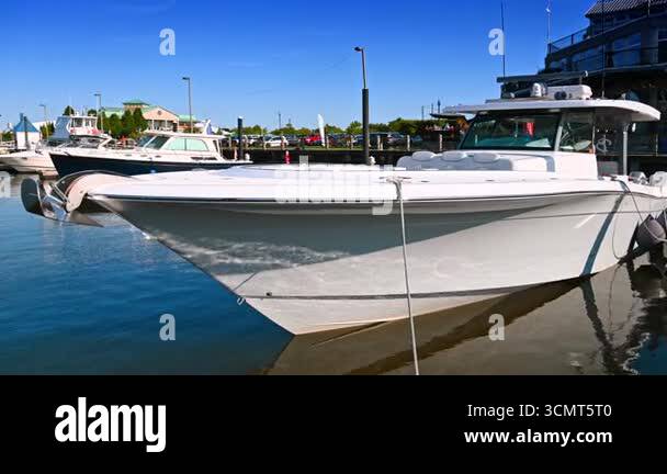 Multiple boats and yachts stand anchored at the berths. Boating and ...