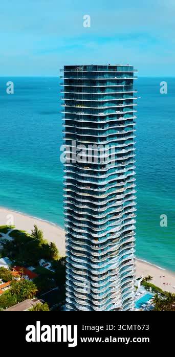 High-rise building standing alone in the scenery of Miami Beach. Top ...
