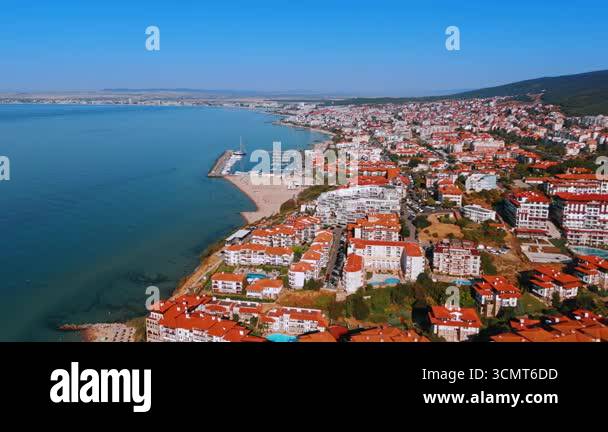 Coastal view of a vibrant seaside town. Overlooking a colorful seaside ...