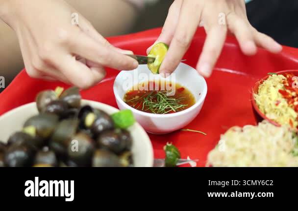 Adding lemon juice to enhance a dipping sauce Stock Video Footage - Alamy