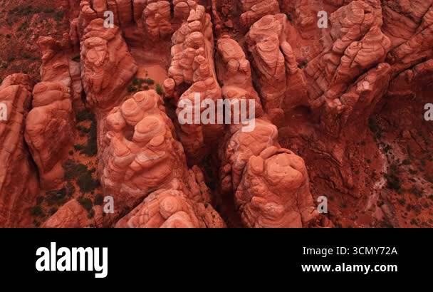 Stunning red rocks rounded by the wind power. Drone flight over the jaw ...