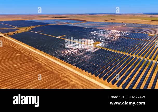 Industrial solar farm in desert region. Large-scale solar power station ...