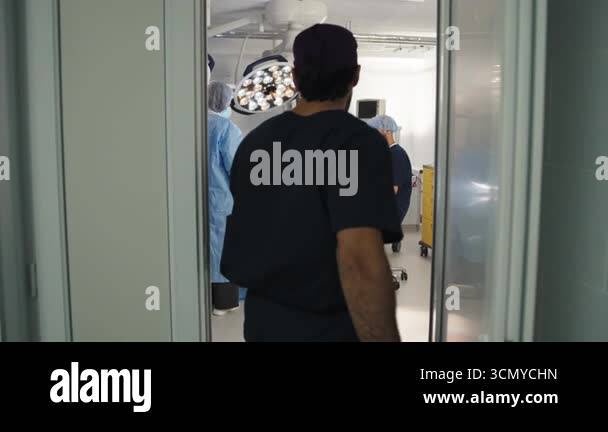 A medical team is performing surgery in a modern operating room ...