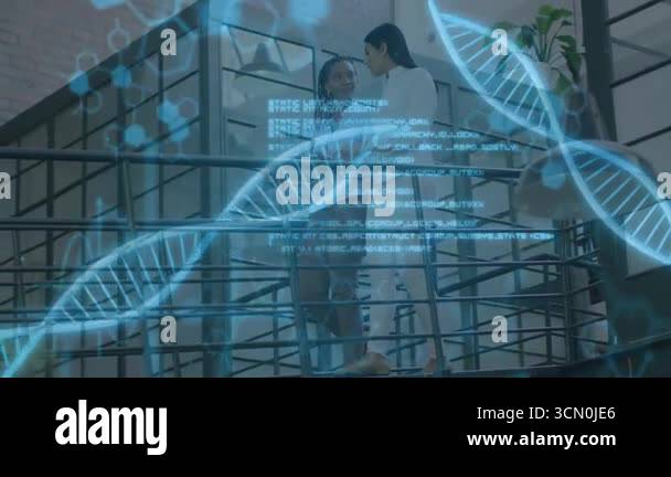 Two lab colleagues tapping trackpad, generating holographic DNA helix and code for biotech ...