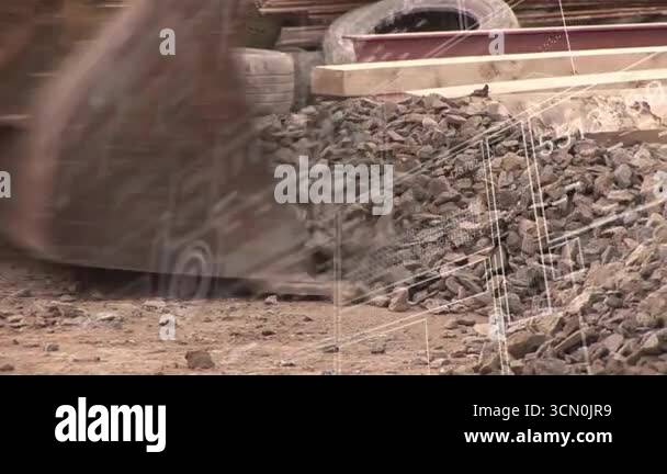 Excavator arm touching crushed stone pile, scooping gravel and dumping ...